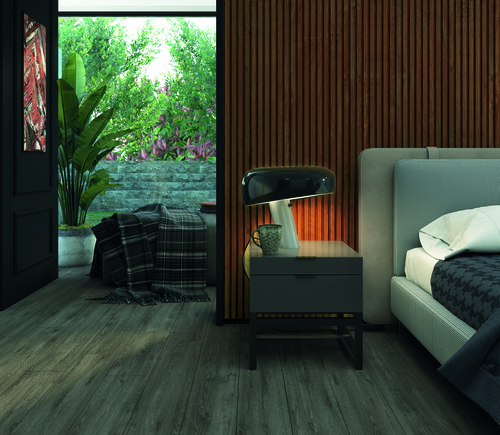 A bedroom with teak coloured AGT wall panels